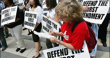 Lips Zipped, Reporter In Jail - CBS News