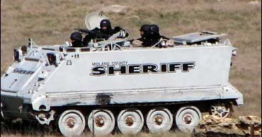 Images Show Cops Well-Armed On Sect Raid - CBS News