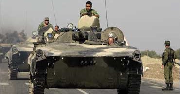 Russia Pulls Back But Flexes Muscle - CBS News