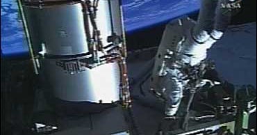 Spacewalking Astronauts Mount Solar Wings - CBS News