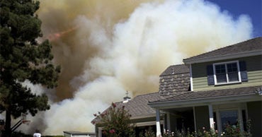 Wildfire Prompts Thousands of Evacuations - CBS News