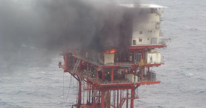 2 workers rescued from burning oil platform - CBS News