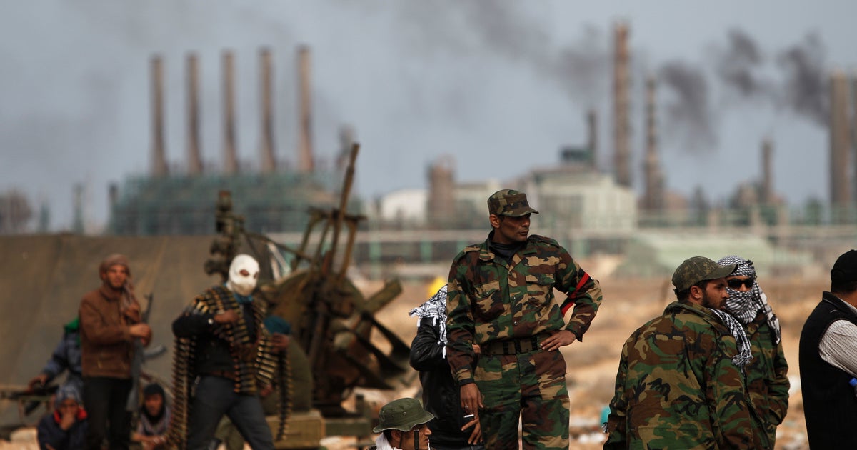 Qaddafi forces show off victory in key city - CBS News