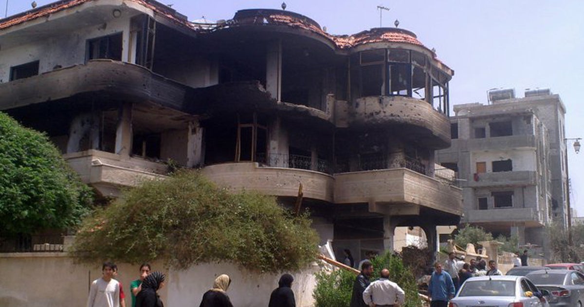 Syrian troops surround Hama as violence mounts - CBS News