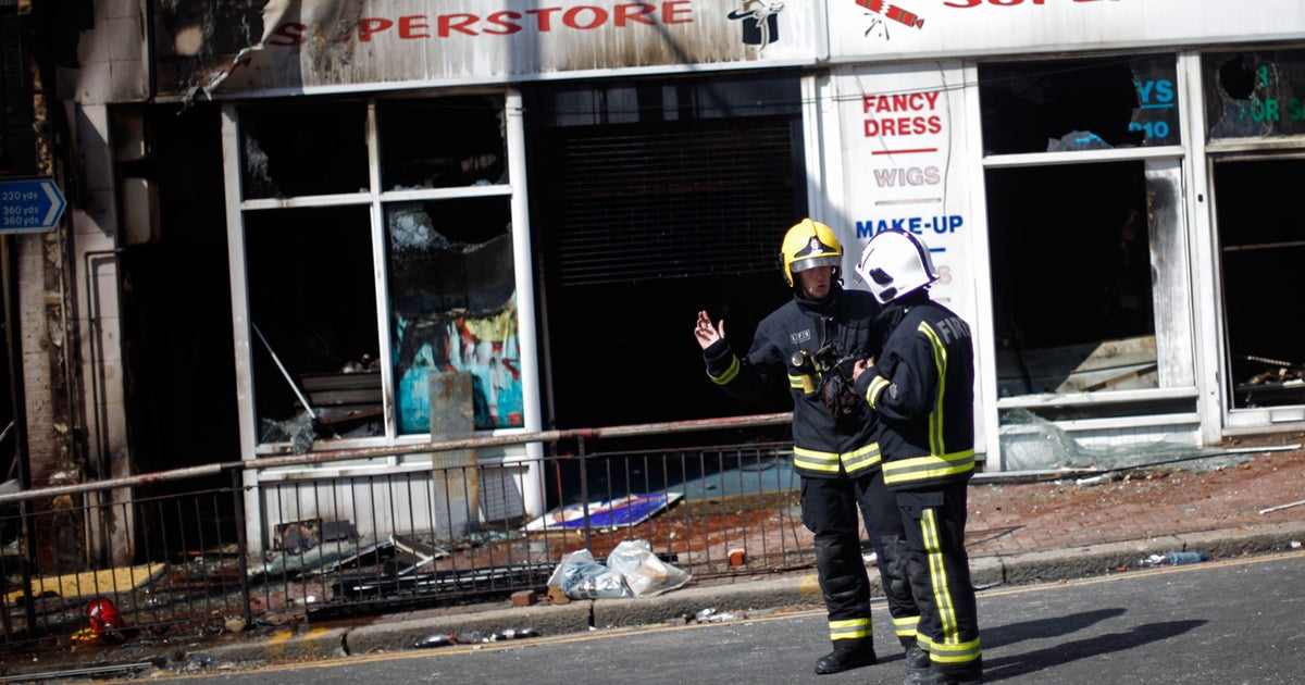 British police face public anger as riots rage - CBS News