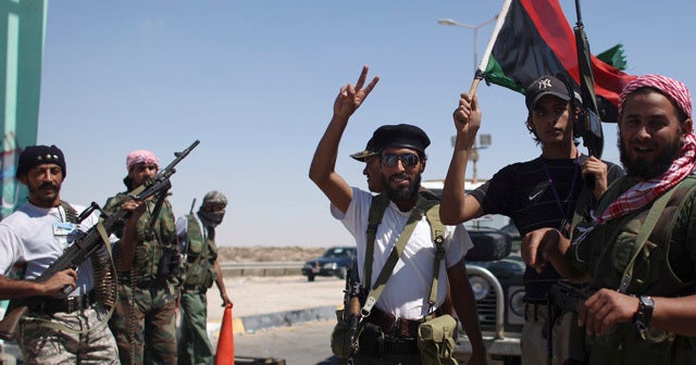 Libyan rebels capture Brega, close in on Qaddafi - CBS News