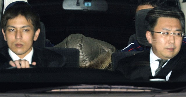 Woman housing Japan cult fugitive in custody - CBS News