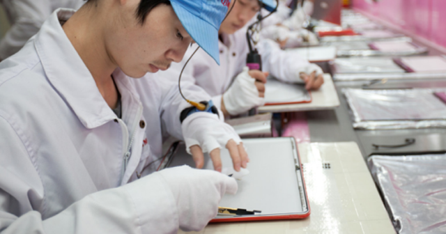 Under pressure, Apple details factory working conditions - CBS News