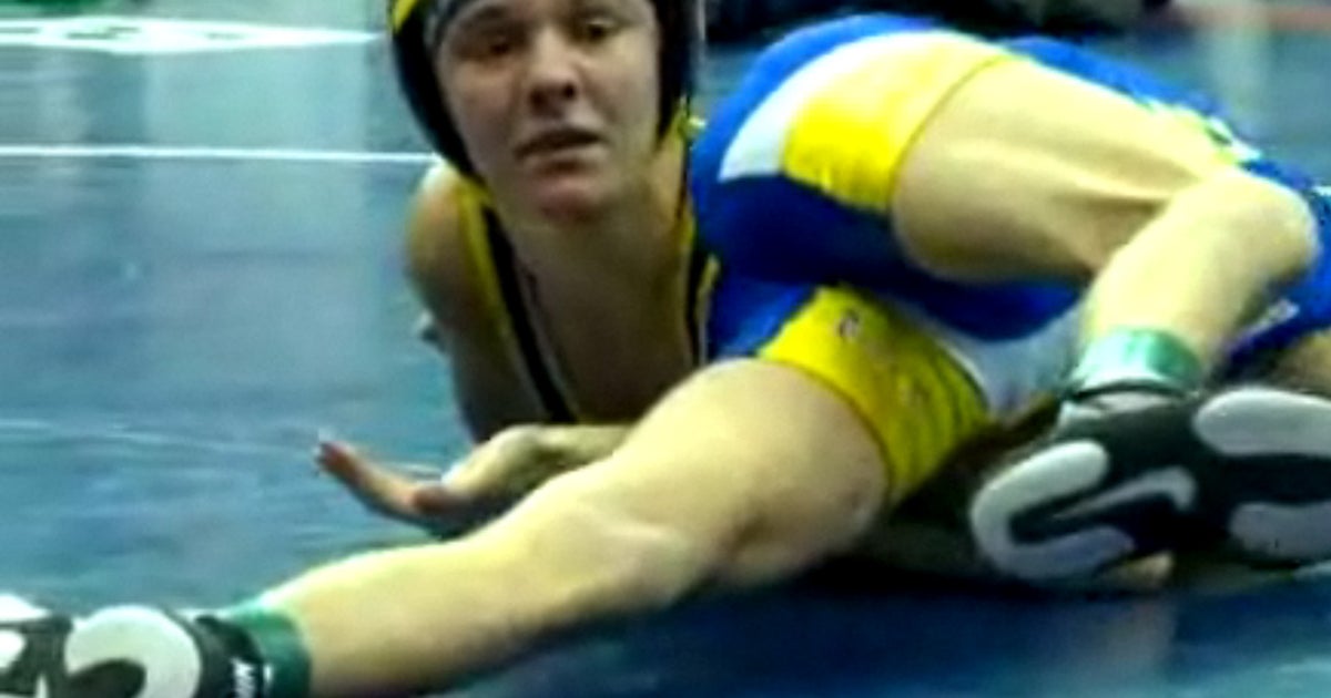 Girl wrestler makes history in Iowa - CBS News
