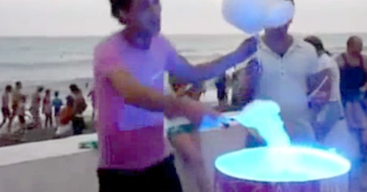 Dancing street artist is the king of cotton candy - CBS News