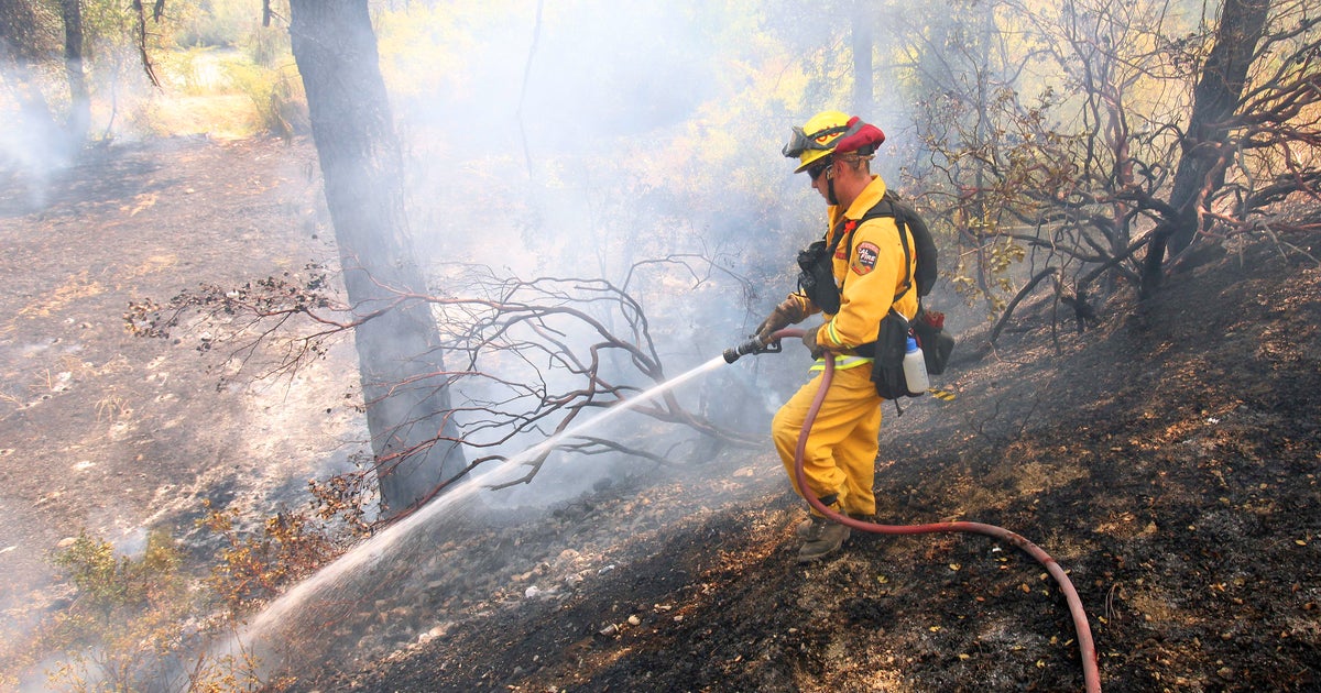 Calif. wildfires threaten thousands of homes - CBS News