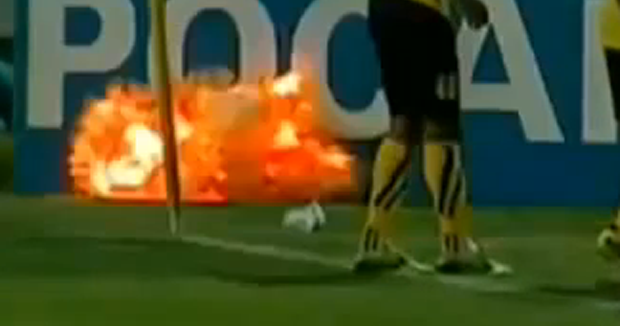 Watch: Soccer player finds grenade on field during game, accidentally ...
