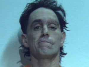 Arrested man breaks out of jail, grabs a beer - CBS News