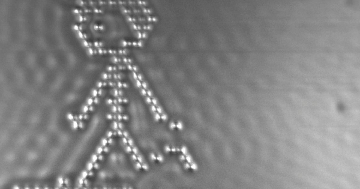 IBM short shows molecules moved to resemble boy playing - CBS News