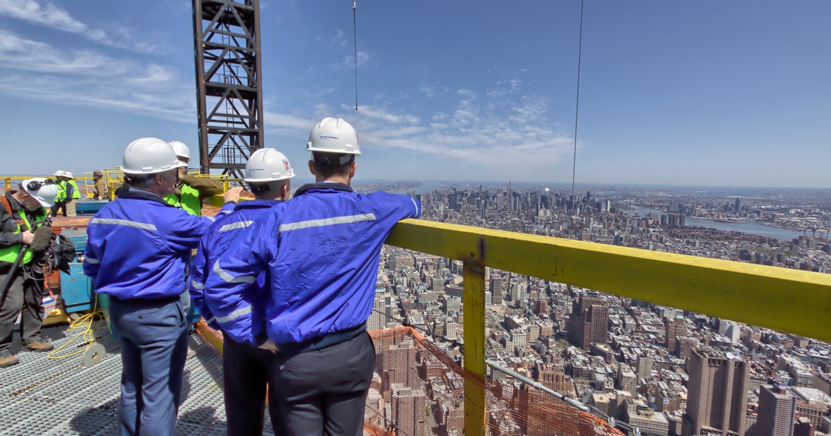 Iconic ground zero tower tops out - CBS News