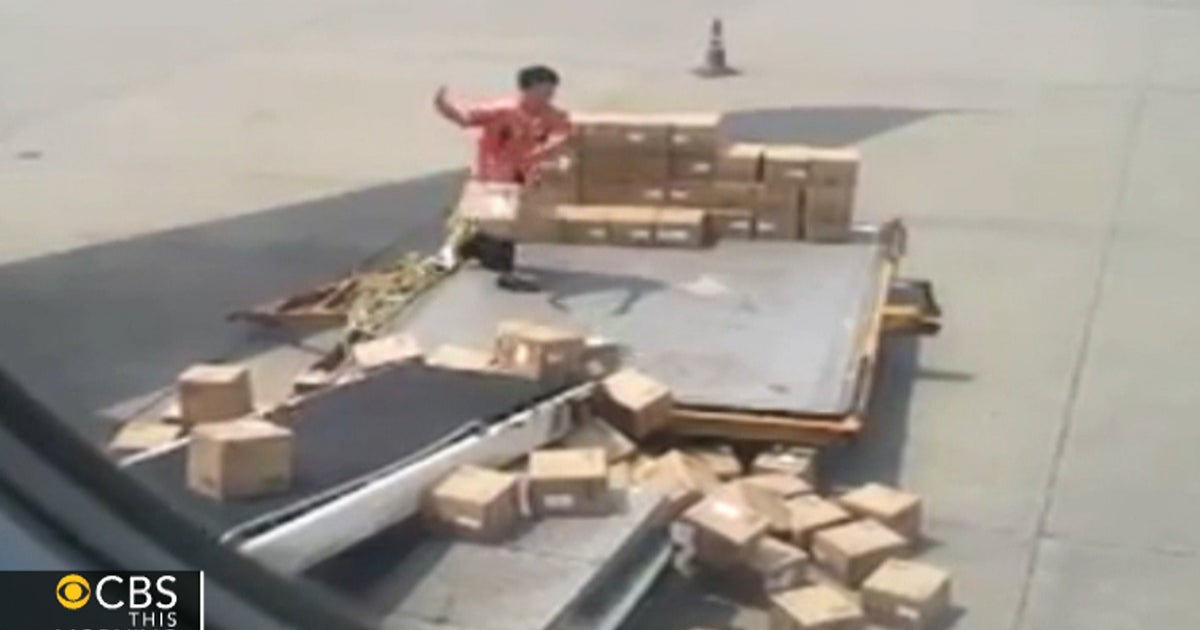 Watch: Careless baggage handler tosses boxes on conveyor belt - CBS News