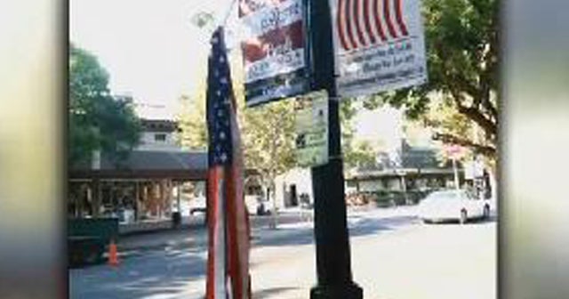 Vandals in Calif. rip American flags before parade, report says - CBS News