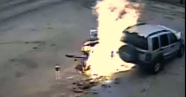 Watch: SUV crashes into gas pumps, catches fire - CBS News