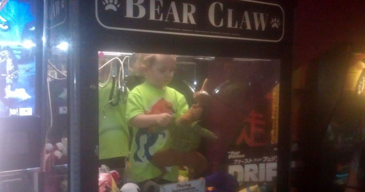 Missing child found stuck inside claw machine - CBS News