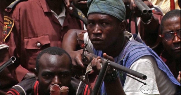 Nigerian hunters seek girls kidnapped by Boko Haram - CBS News