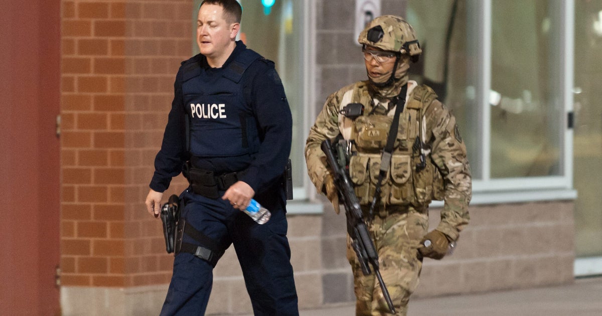 Manhunt after 3 cops shot dead in Canada - CBS News