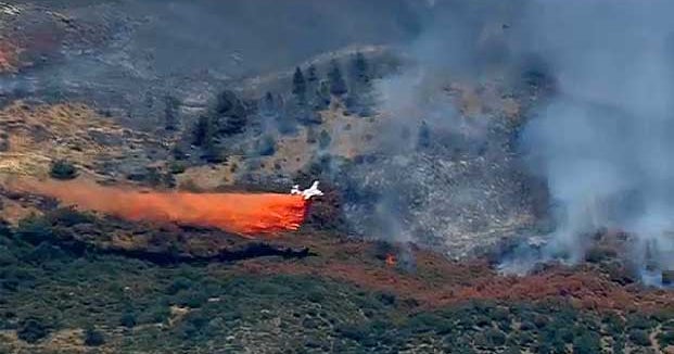San Diego County wildfires burn homes, threaten more - CBS News