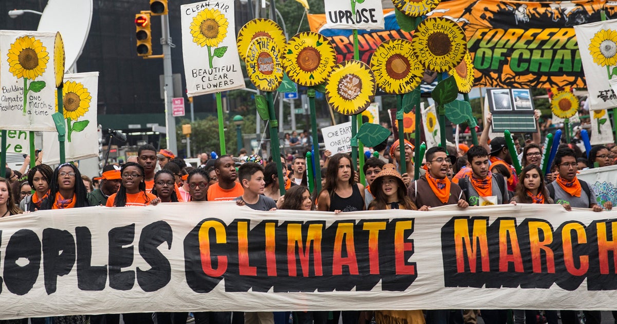 300,000 marchers ring climate warning bell in NYC, around globe - CBS News