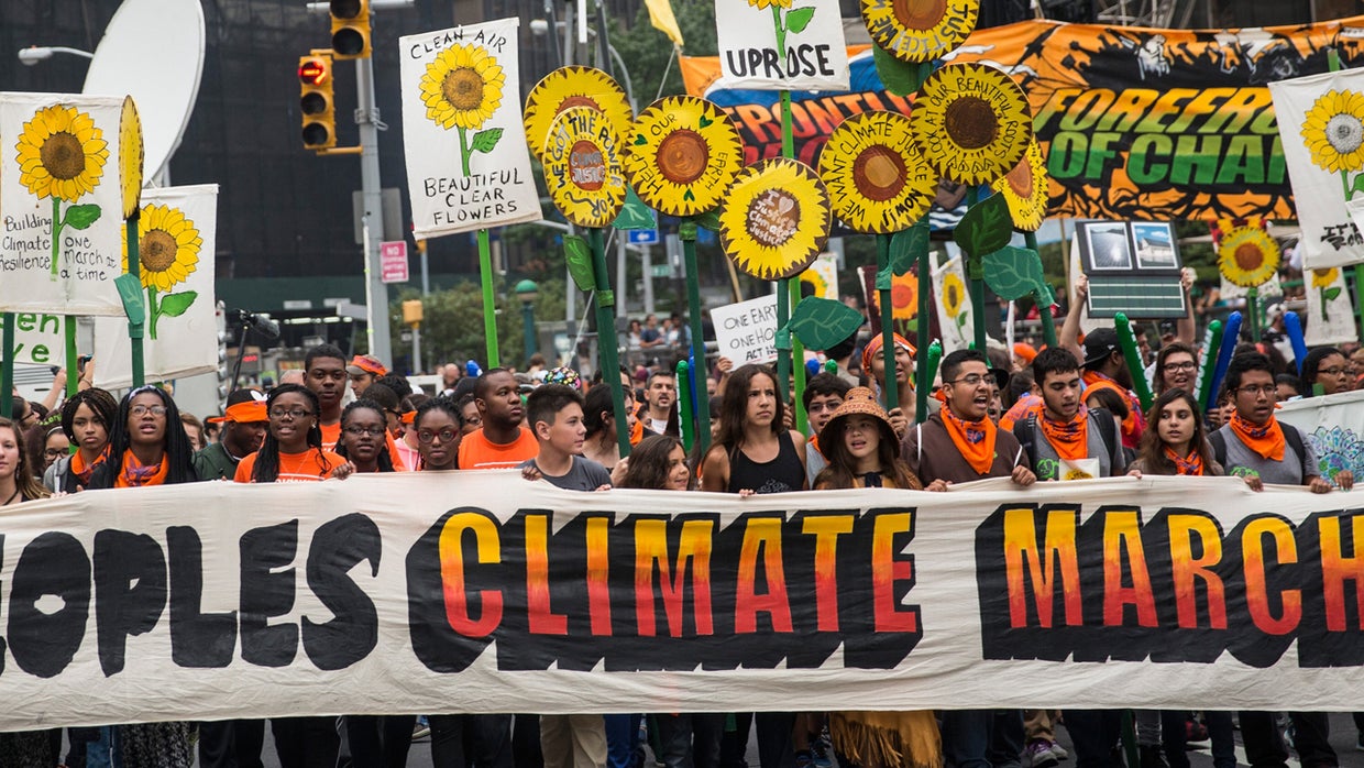 300,000 marchers ring climate warning bell in NYC, around globe - CBS News