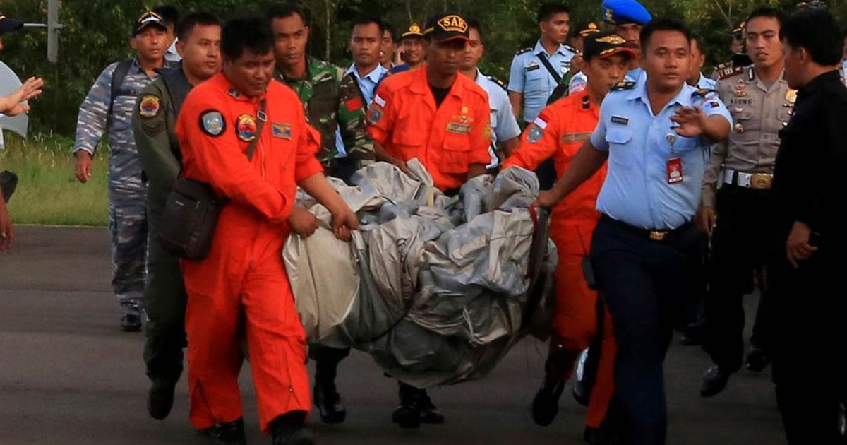 AirAsia Flight 8501: Weather hampering search and recovery effort - CBS ...