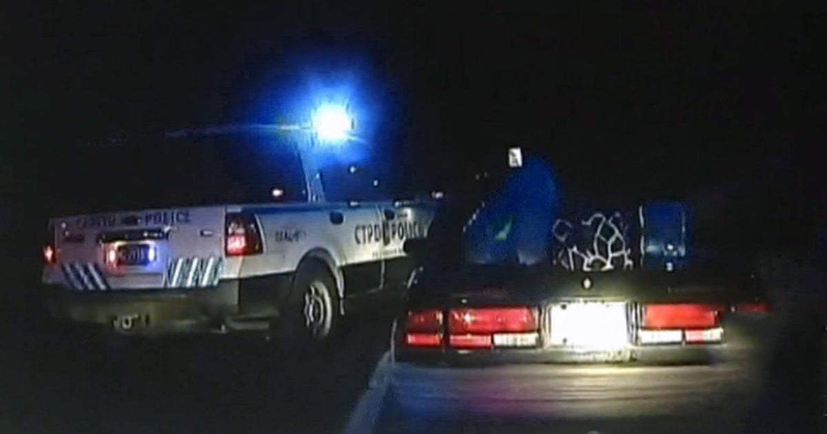 Handcuffed woman steals police car then drives off - CBS News