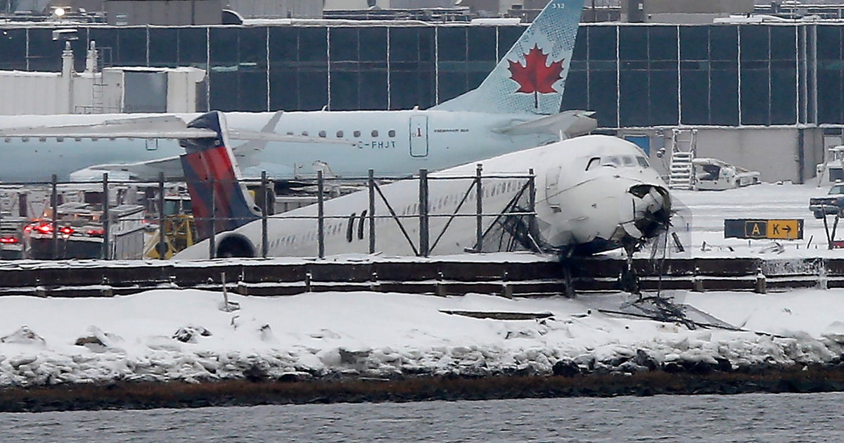 Plane skids off runway at LaGuardia