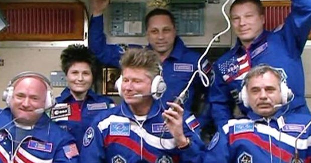 Astronauts begin one-year space station mission - CBS News