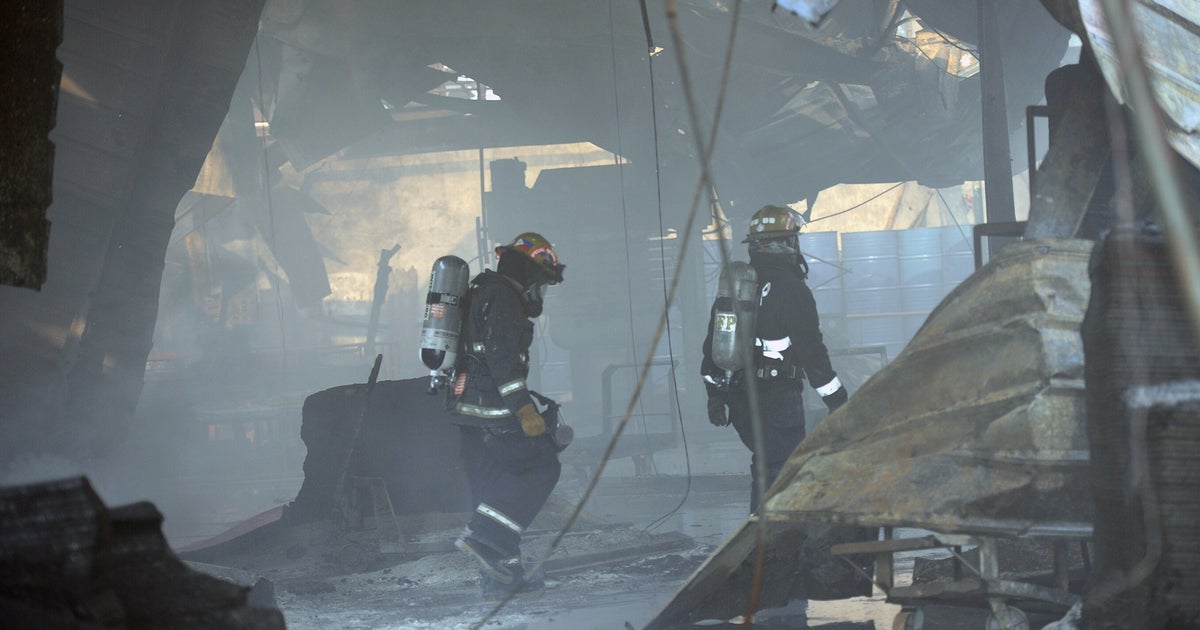 Philippines factory fire trapped workers on 2nd floor of Kentex rubber ...