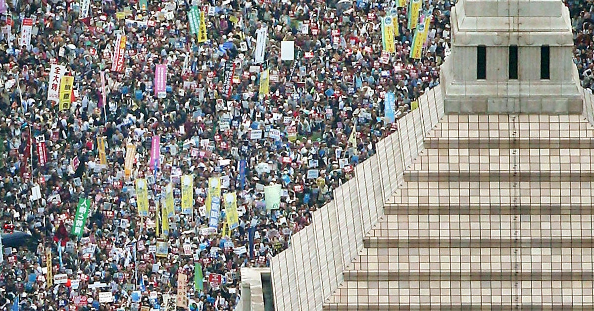 Japan's plan for combat troops sees mass opposition - CBS News