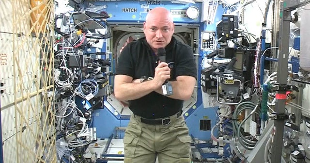 NASA's Scott Kelly goes head over heels in space - CBS News