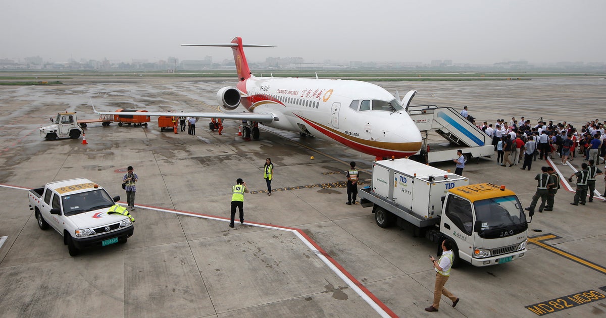 First made-in-China jetliner makes debut commercial flight - CBS News