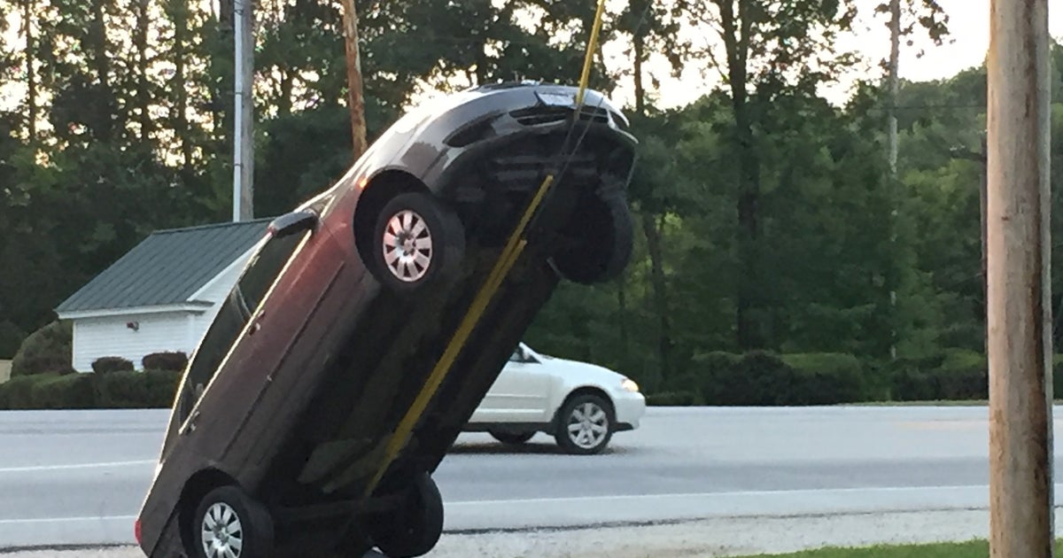 Car ends up nearly vertical after mishap with GPS - CBS News
