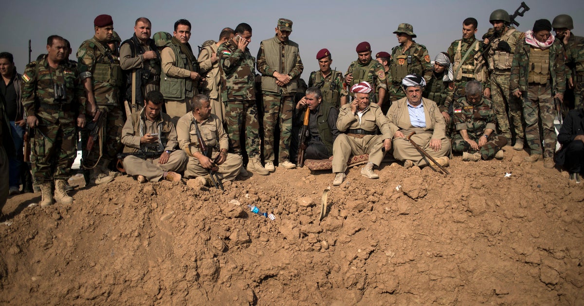 Iraqi Kurdish fighters discover mass grave of decapitated bodies near ...