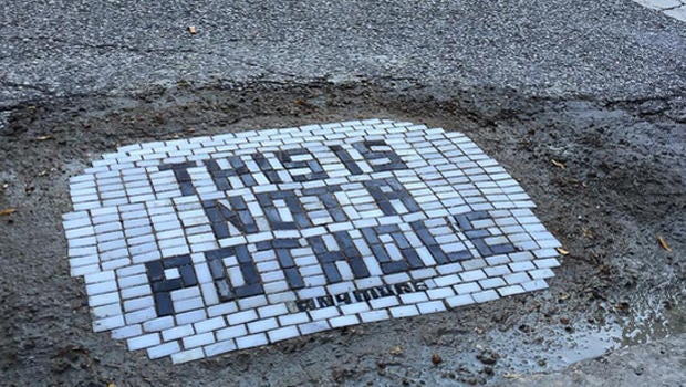 Pothole mosaics: Street art that fills a need - CBS News