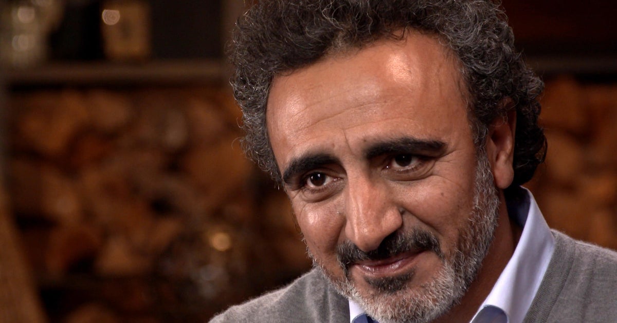 Chobani founder stands by hiring refugees - CBS News