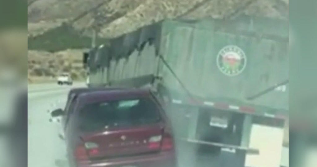 Car gets dragged along California freeway as driver waves for help ...