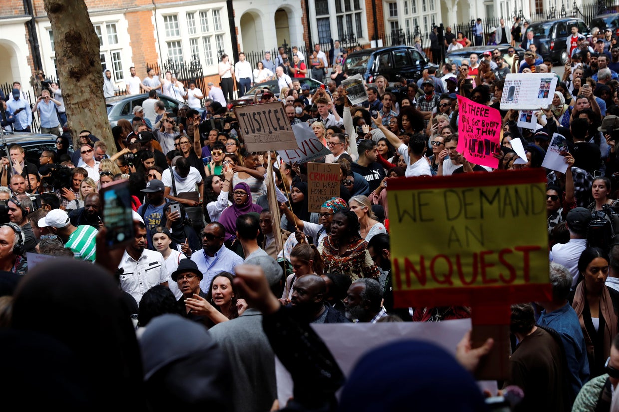 Protests in London erupt at town hall over high-rise fire - CBS News