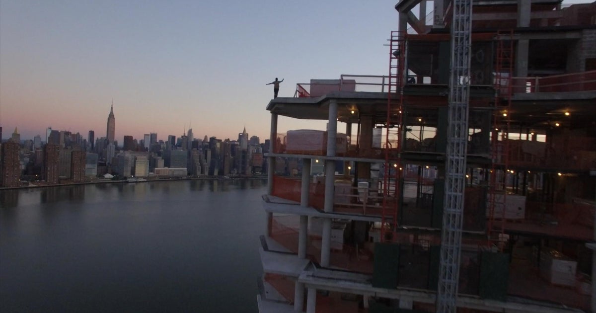 What pushes these daredevil photographers to the edge? - CBS News