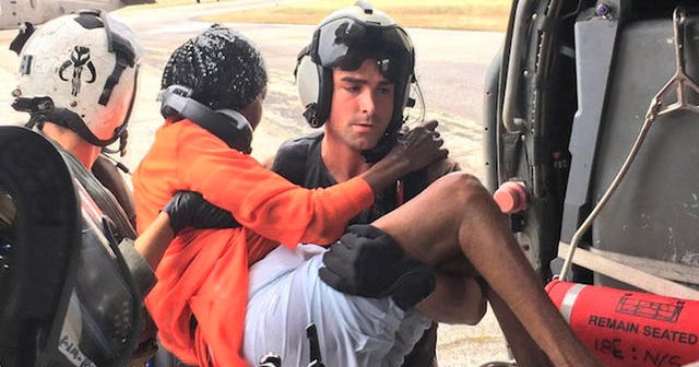 Navy helicopter rescue teams pluck Texans from flooding - CBS News