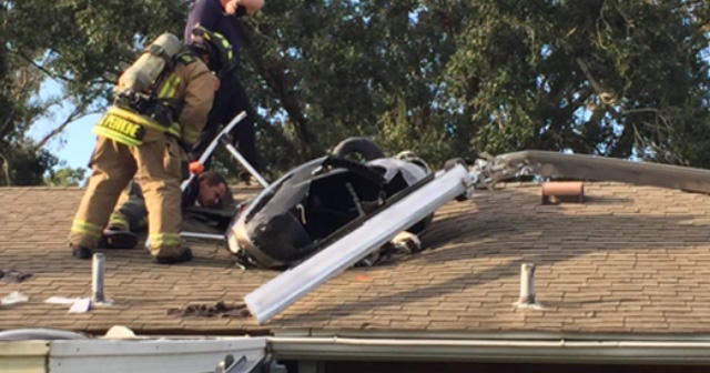 Homemade helicopter crashes into roof - CBS News