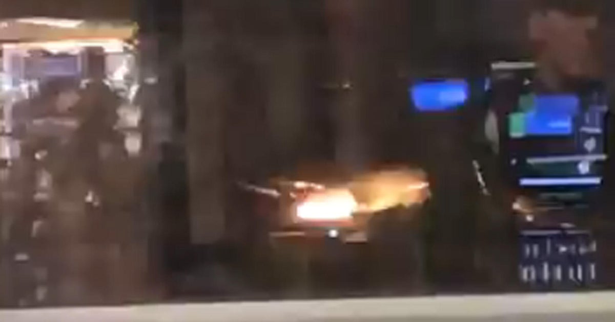 Watch: Plane engine catches fire as it lands at Seattle airport - CBS News