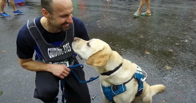 How a blind runner regained his footing with a special guide dog - CBS News