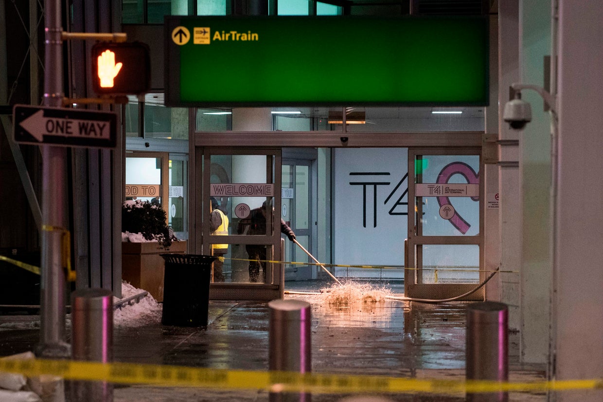 "Cascading failures" strand thousands at flooded, frigid JFK - CBS News