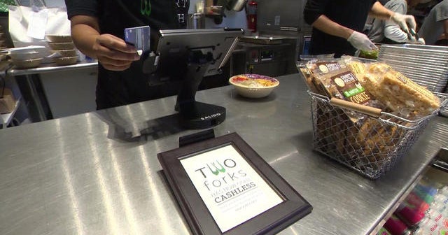 Some businesses banning cash - CBS News