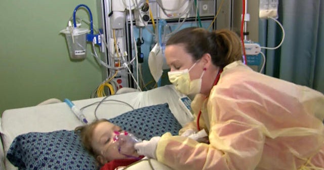 Doctor tries new approach to treating the flu - CBS News